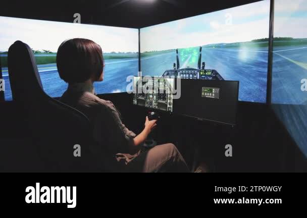 Young female person holding joystick and landing virtual airplane on ...
