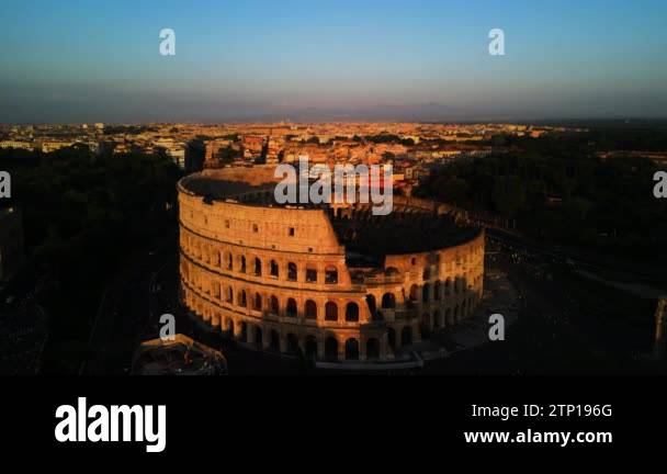 Sunset silhouette of the Colosseum, a majestic ancient amphitheater ...