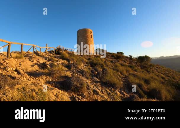 Sunrise over Mediterranean sea. Historic Torre Vigia De Cerro Gordo, a ...