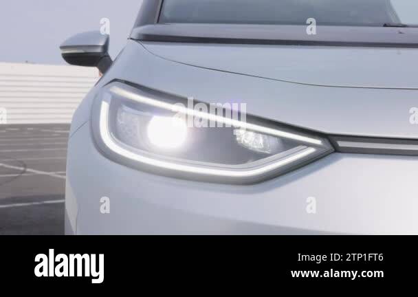Modern car headlamp flashing light with blinking on continuously ...