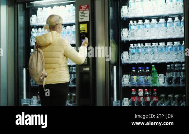 Niagara Falls, NY, USA, September, 2017: A woman buys water in a ...