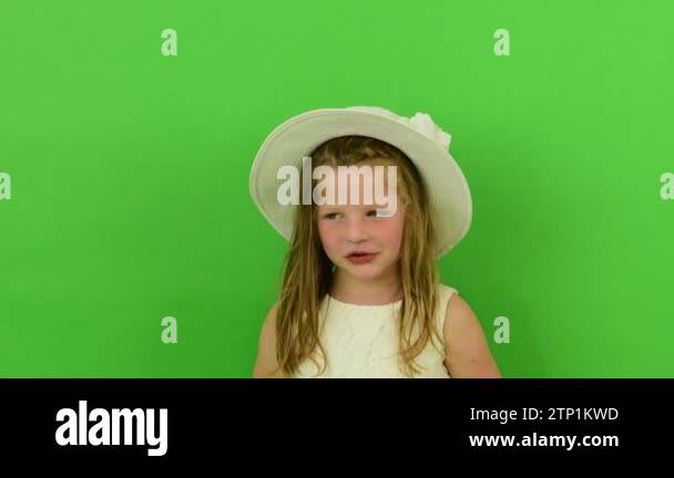 Cute small girl on chroma key background. Little girl dressed in a ...