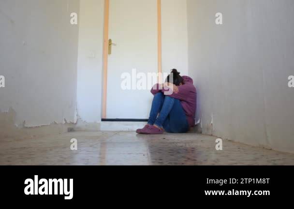 Consequences of domestic violence and abuse, showing a woman in the ...