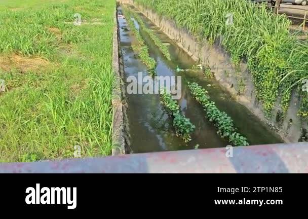 bridge crossing the outdoor concrete drainage system at the city street ...