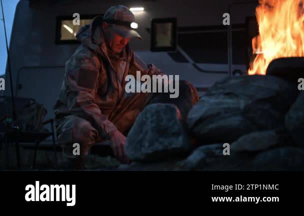 Hunter Wearing Camouflage Coating Burning Campfire Next to His ...