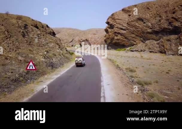 Drone footage of a 4x4 safari car ride between huge rocks in Namibia ...