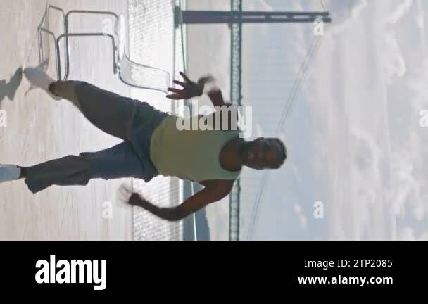 Flexible dancer practising choreography sea background vertically ...