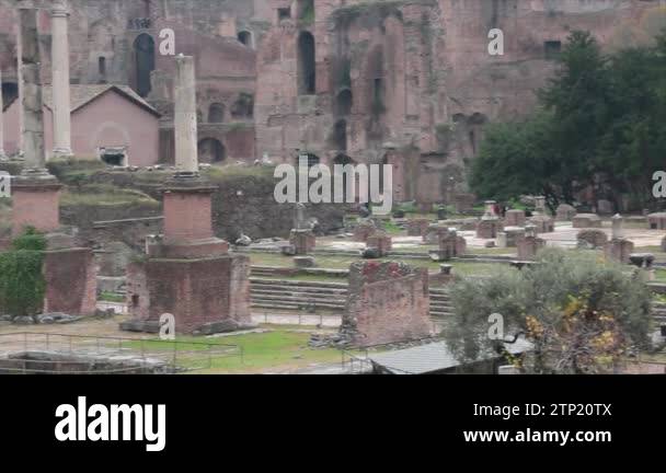 rome italy roman ancient ruins pan from left to right with temple of ...