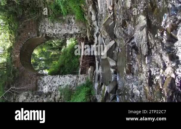 Picturesque ruins of the narrow-gauge viaduct carriage bridge in the ...