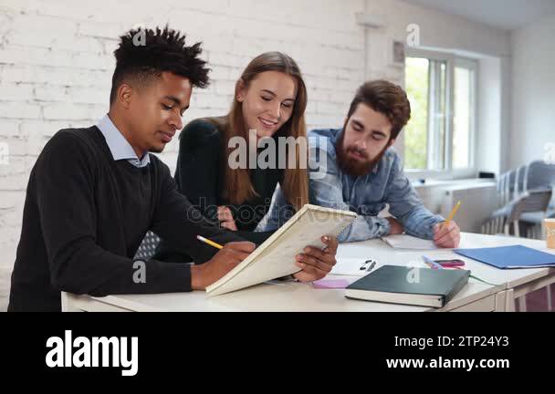 Multiethnic group of people working together. Young african guy ...