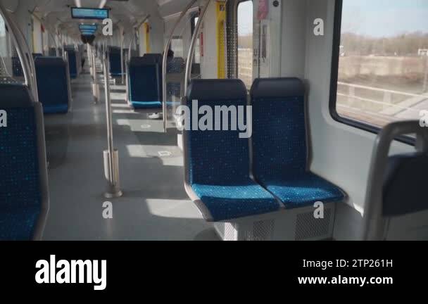 Empty suburban train coach in Munich, Germany. Interior with blue seats ...