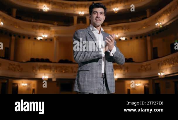 crazy mad singer clapping to himself, empty seats of concert hall in ...