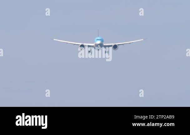 Airplane approaching for landing, bottom view. Jet passenger plane ...