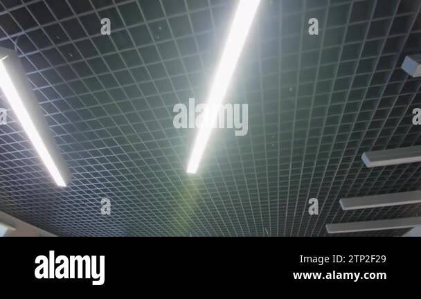 Cold neon lights from ceiling in modernized classroom. Illumination of ...