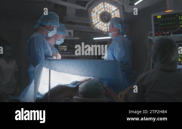 Nurses assist doctors, give medical instruments. Professional surgeons ...