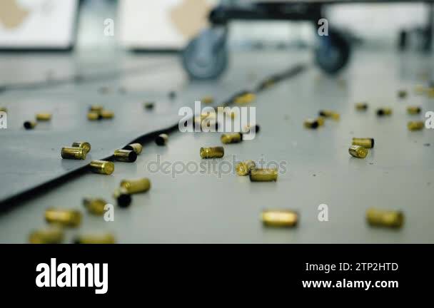 Huge number of shell casings from bullets lying on the floor in the ...