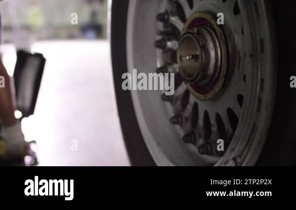 Airport worker checking chassis. Engine and chassis of the passenger ...
