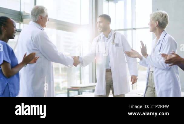 Meeting, applause or doctors shaking hands for success, good job or promotion in a hospital ...