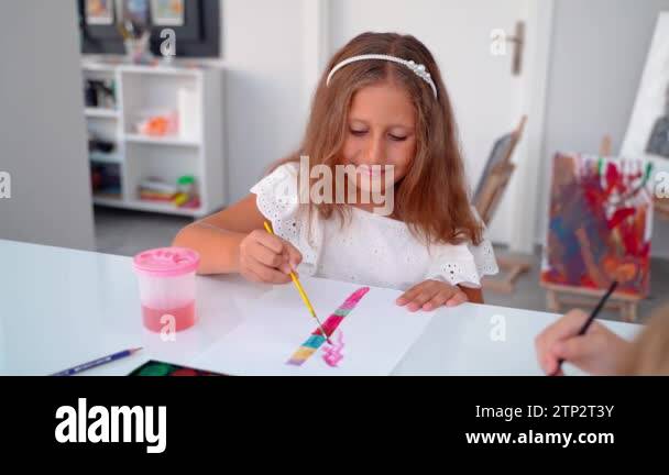 Closeup child paint with watercolor in Art Class Studio with painting ...