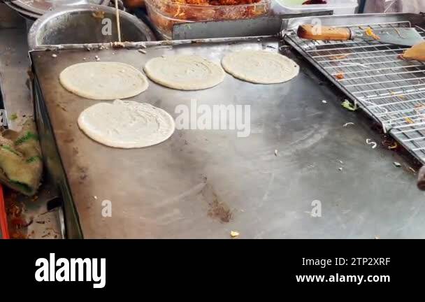 Thai crispy pancakes topped with strips of egg yolks or traditional ...