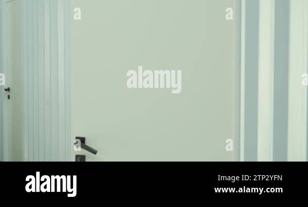 Dejected office worker as she steps out of the office with a heavy ...