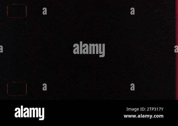 A vintage Super 8mm film frame overlay with a sprocket hole, dirt, hair ...