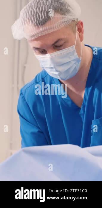 Doctor and assistant of the venous vascular surgery clinic during leg ...