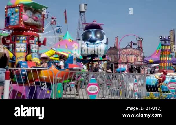 People riding on spinning swing carousel in amusement park Swing rides ...