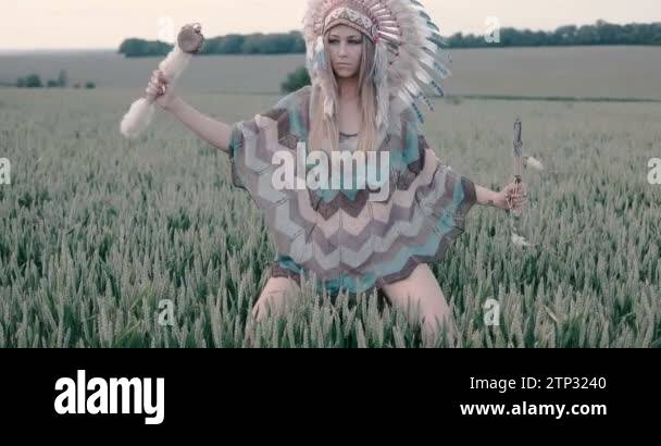 Native American Indian looking beautiful woman with tomahawks in the ...