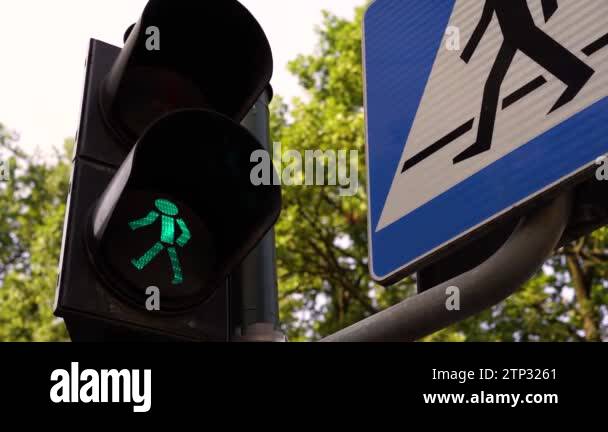 Close-up of traffic light at intersection of large city,regulating ...