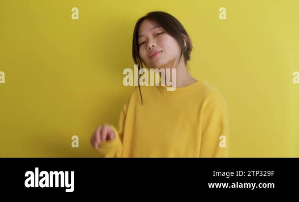 shy teenager girl flirting, saying hello, blowing kiss, laughing ...