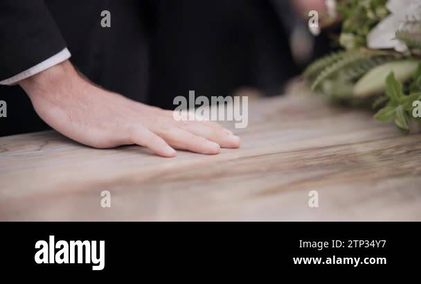 Death, funeral and hand of man on coffin, family at service in ...