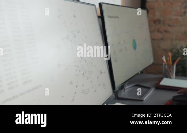 Focus on computer screens with diagrams and figures Stock Video Footage ...