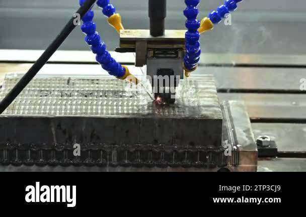 The EDM machine operation with liquid coolant method. Mold and die ...