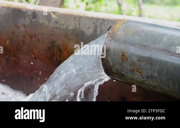 FHD footage of water coming out from tube well pipe. Concept of ...