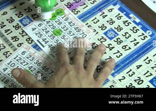 A man marks-off his BINGO cards Stock Video Footage - Alamy