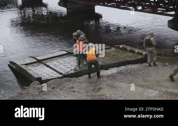 Pontoon bridge of the Ukrainian army. Installation of a temporary ...