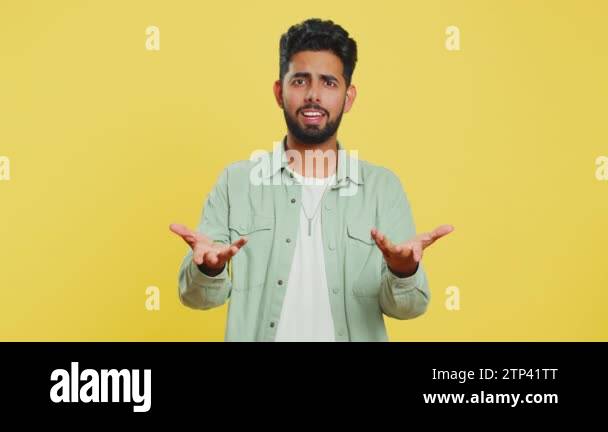 What. Why. Angry Indian man raising hands in indignant expression ...
