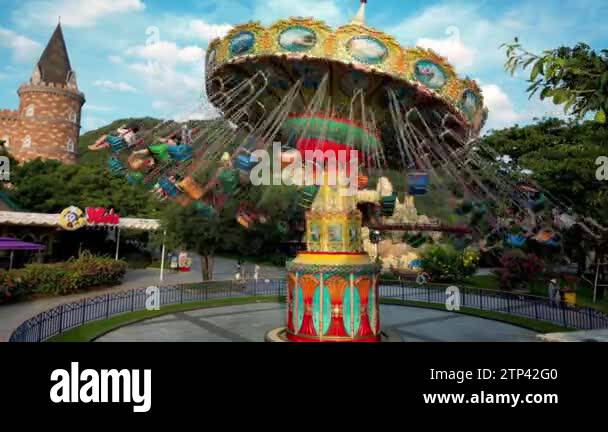 Illuminated merry go round carousel filmed at night in amusement park Stock Video Footage - Alamy