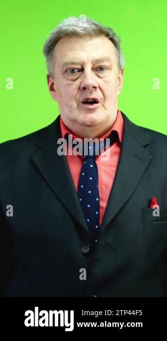 Senior newscaster journalist or speaker presenting news. Local newsreader speaks in TV studio ...