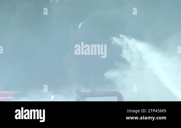 A fuel tank and a reactor are burning, firefighters are extinguishing ...