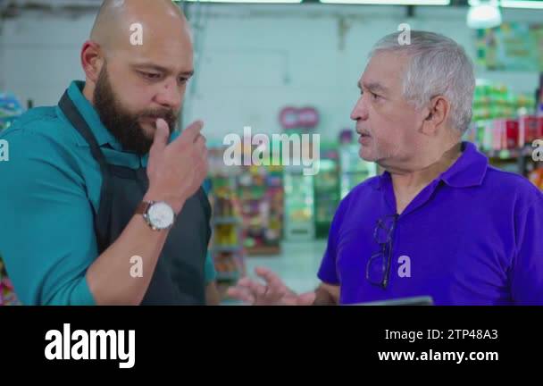 Upset boss scolding employee at supermarket business store ...