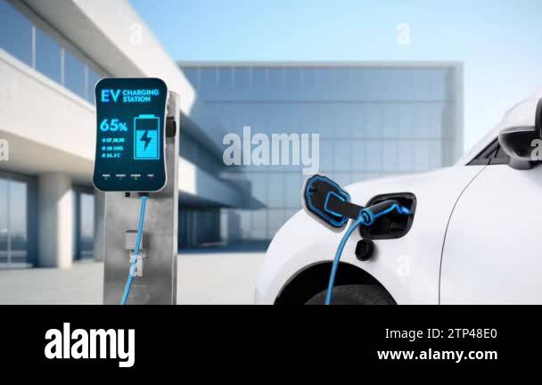 Electric car recharging from smart EV charging station in modern and ...