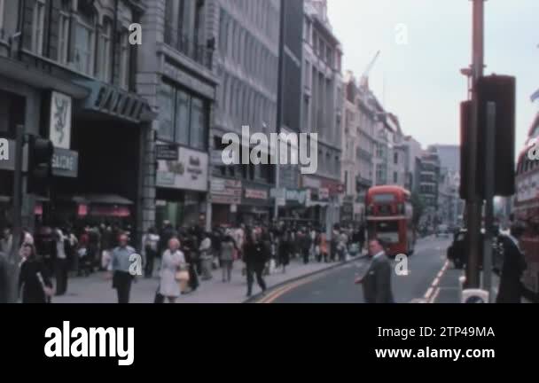 London in 1960s with crowded scene on Oxford Street filled with people ...