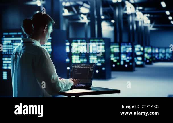 Asian System Administrator Running Code And Programming On Laptop Troubleshooting And Upgrading