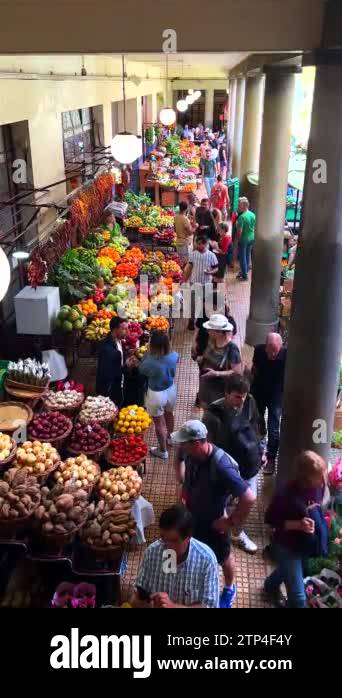 Vibrant video capturing the lively atmosphere of a crowded fruit market ...