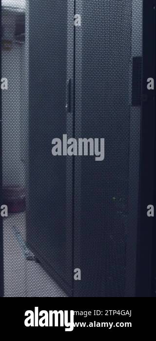 Vertical video of a large computer server room in a data center with blinking lights Stock Video ...
