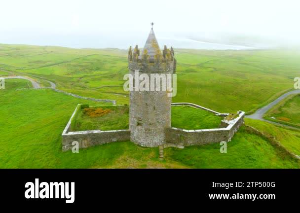 Doonagore Castle aerial foggy view, iconic landmark, one of the most ...