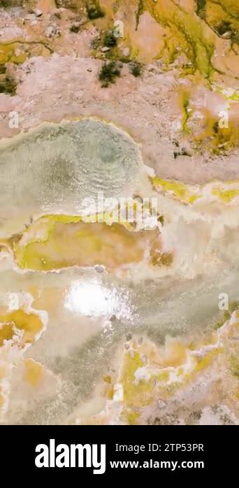 Boiling geothermal hot springs covered with sulfur and volcanic ...