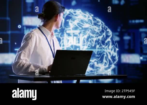 Admin using laptop to visualize artificial intelligence neural networks ...